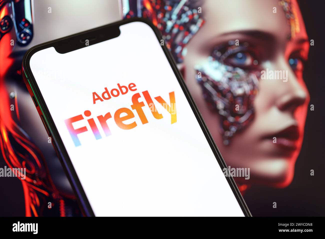 KYIV, UKRAINE - MARCH 17, 2024 Adobe Firefly logo on iPhone display screen with background of ...