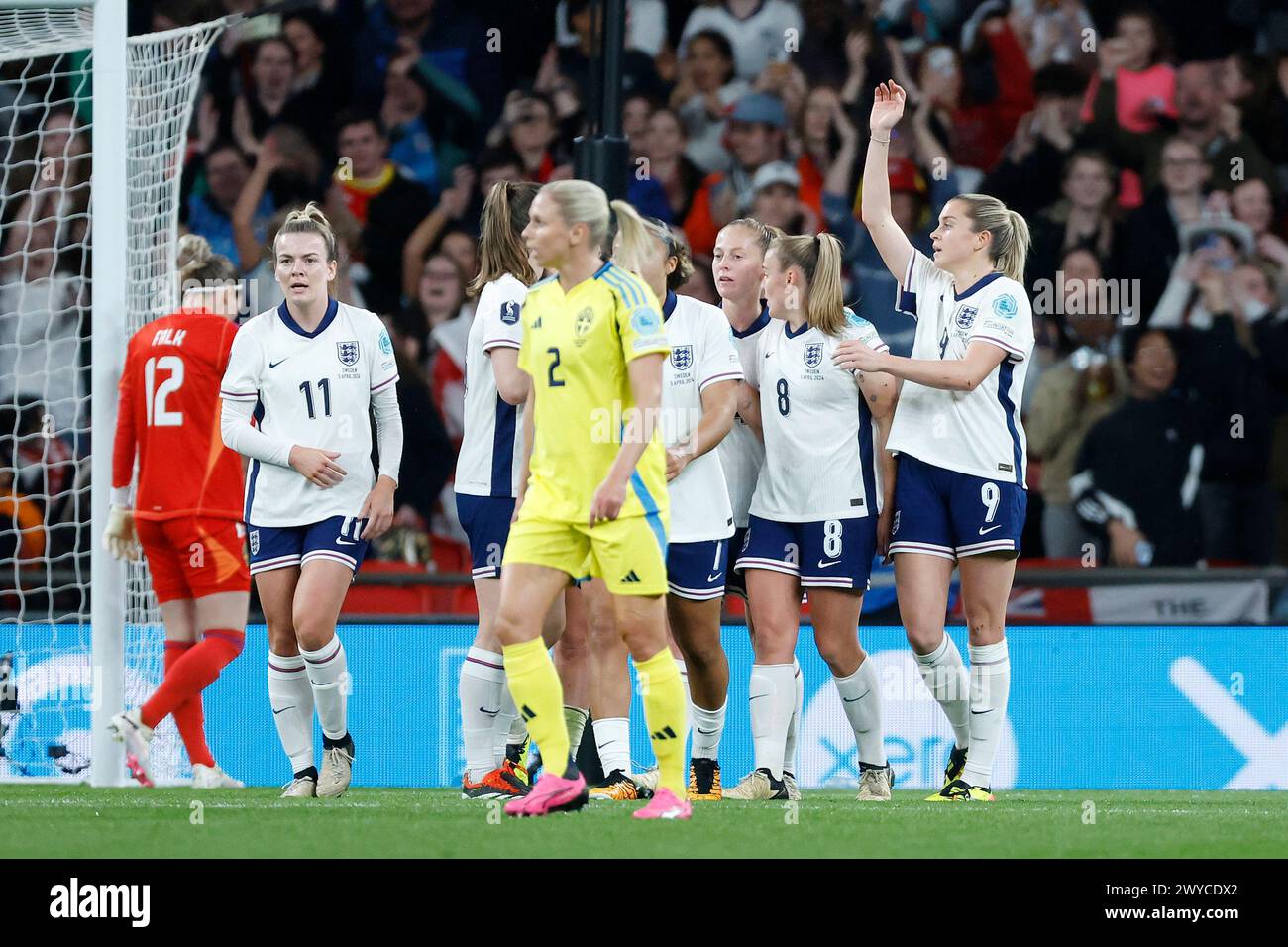 England’s Alessia Russo (right) celebrates with team-mates after ...