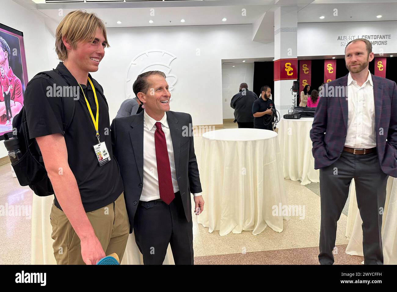 Eric Musselman, center, poses for photos with a fan after his ...