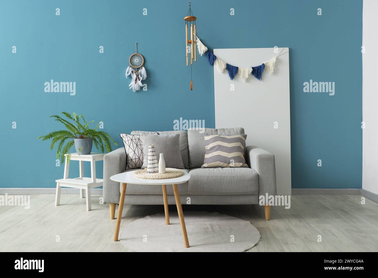 Interior of living room with wind chime, dream catcher and sofa Stock ...