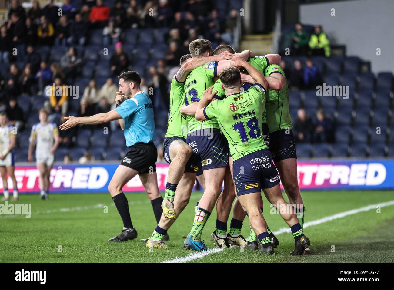 Joe Bullock of Warrington Wolves celebrates his try to make it 4-14 ...