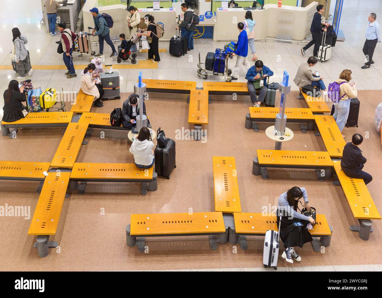 travelers wait at the Incheon International Airport Stock Photo - Alamy