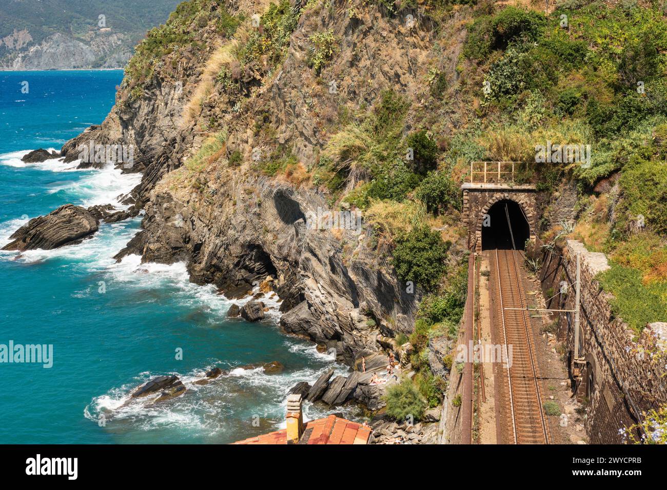 railroad tracks in Vernazza near a sea, there trains between five ...