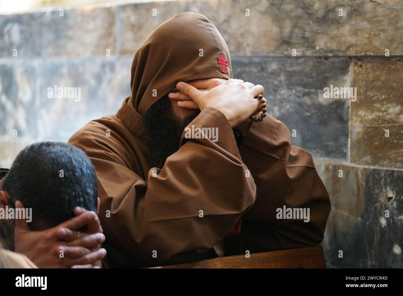 Mosul, Iraq. 05th Apr, 2024. Iraqi Christian Monk prays during the mass ...