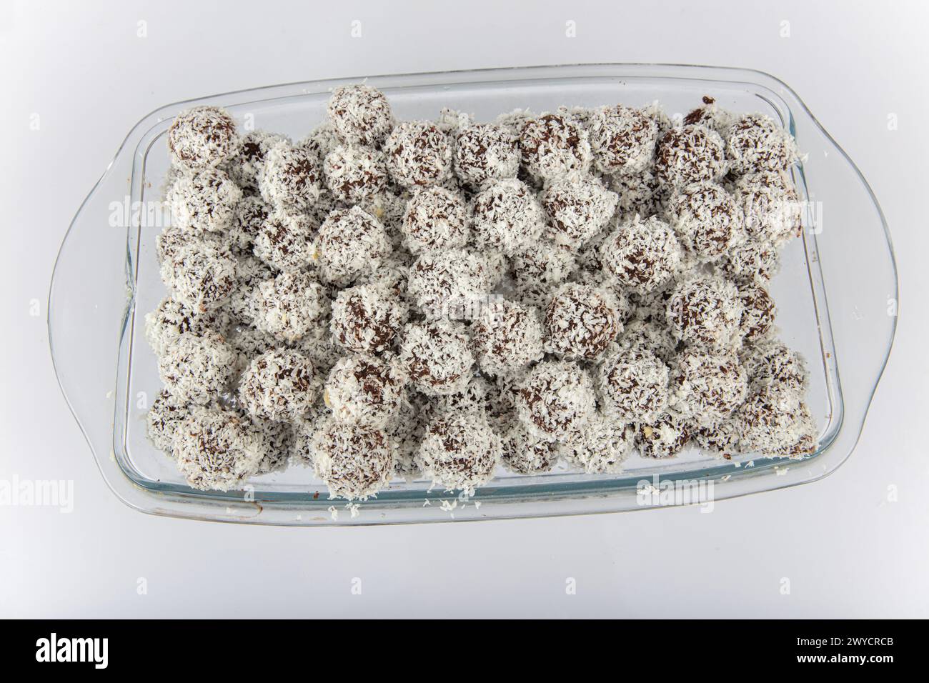 Coconut and cocoa happiness balls. Rum balls in coconut. Traditional ...