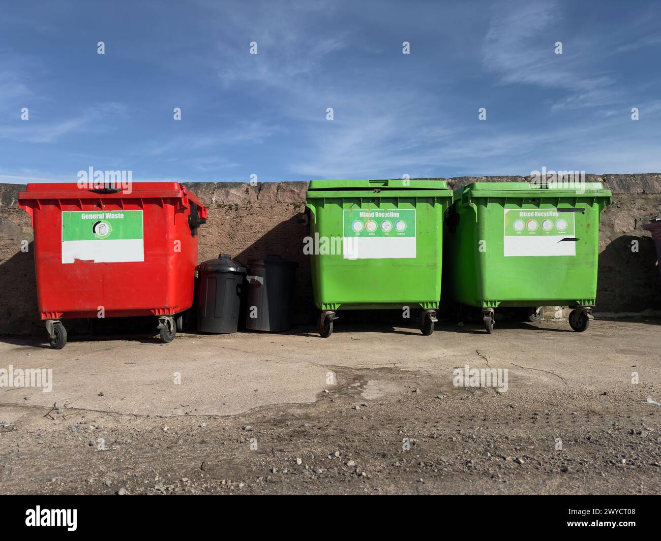 Wheelie bins in row segregated for recycling rubbish Stock Photo - Alamy