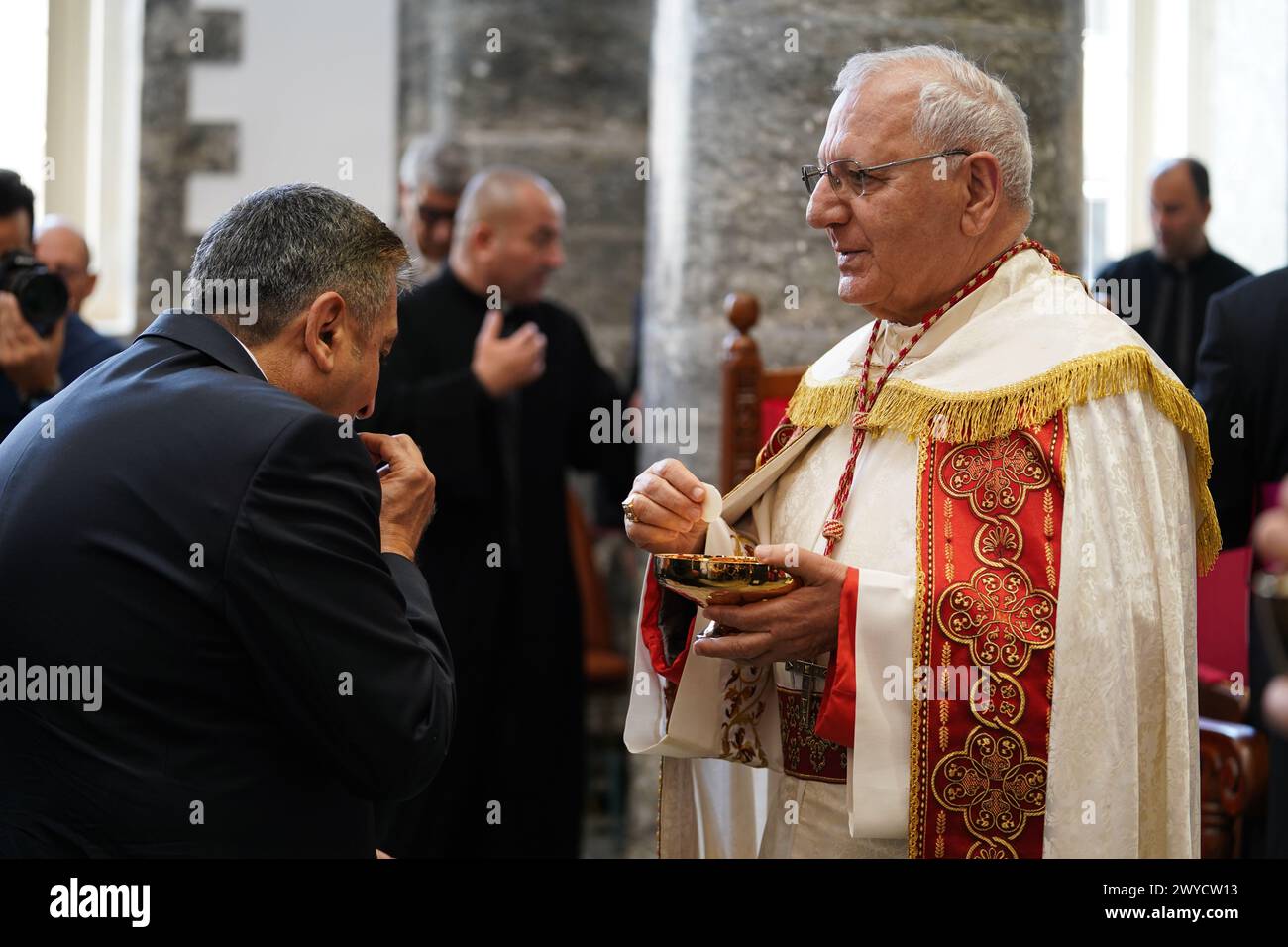 Mosul, Iraq. 05th Apr, 2024. Cardinal Louis Raphael Sako (R), the ...