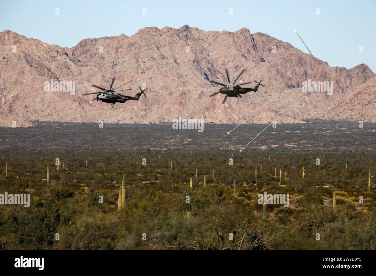 Two U.S. Marine Corps CH-53E Super Stallion helicopters assigned to ...