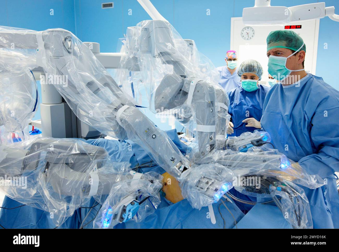 Woman surgeon operating da vinci system hi-res stock photography and ...