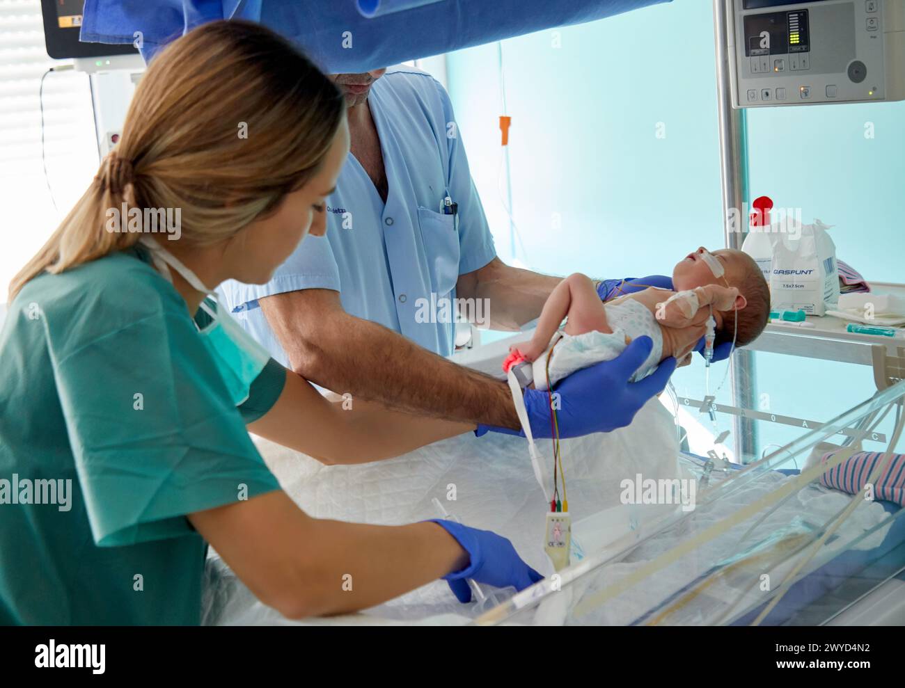Team of doctors and nurses attending to a baby, Neonatal pediatrics ...