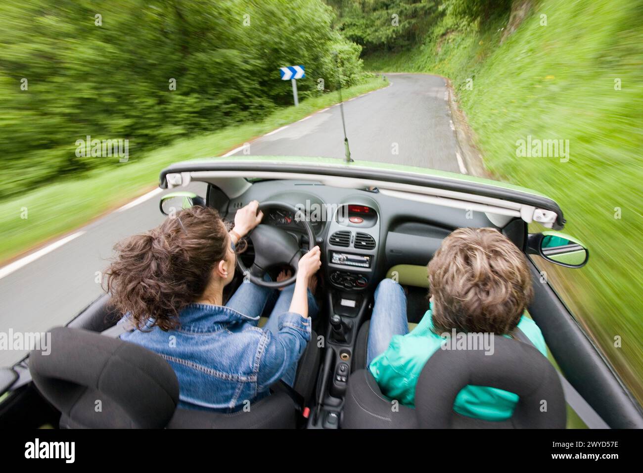 Woman driving fast in convertible hi-res stock photography and images ...