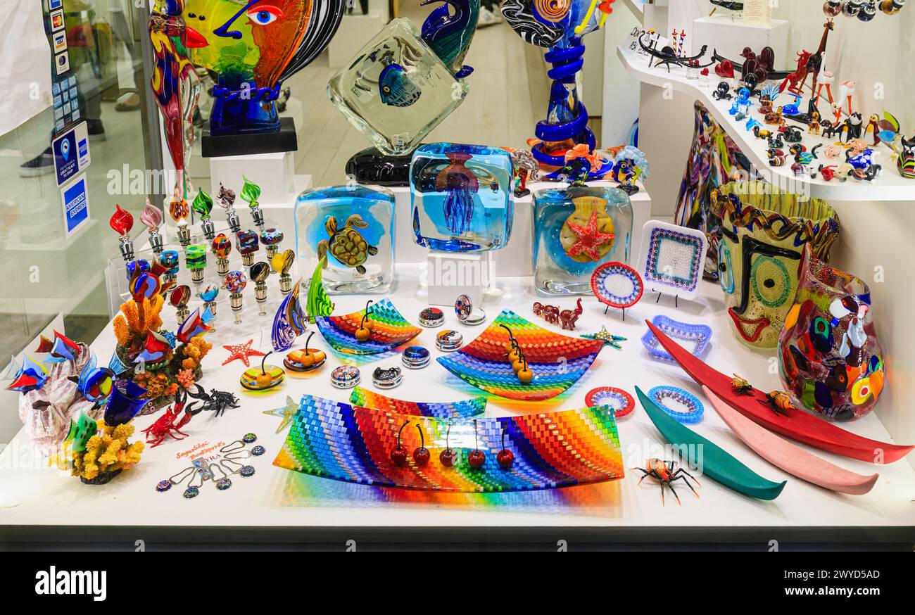Display of colourful glasswork for tourist souvenirs in a shop window ...