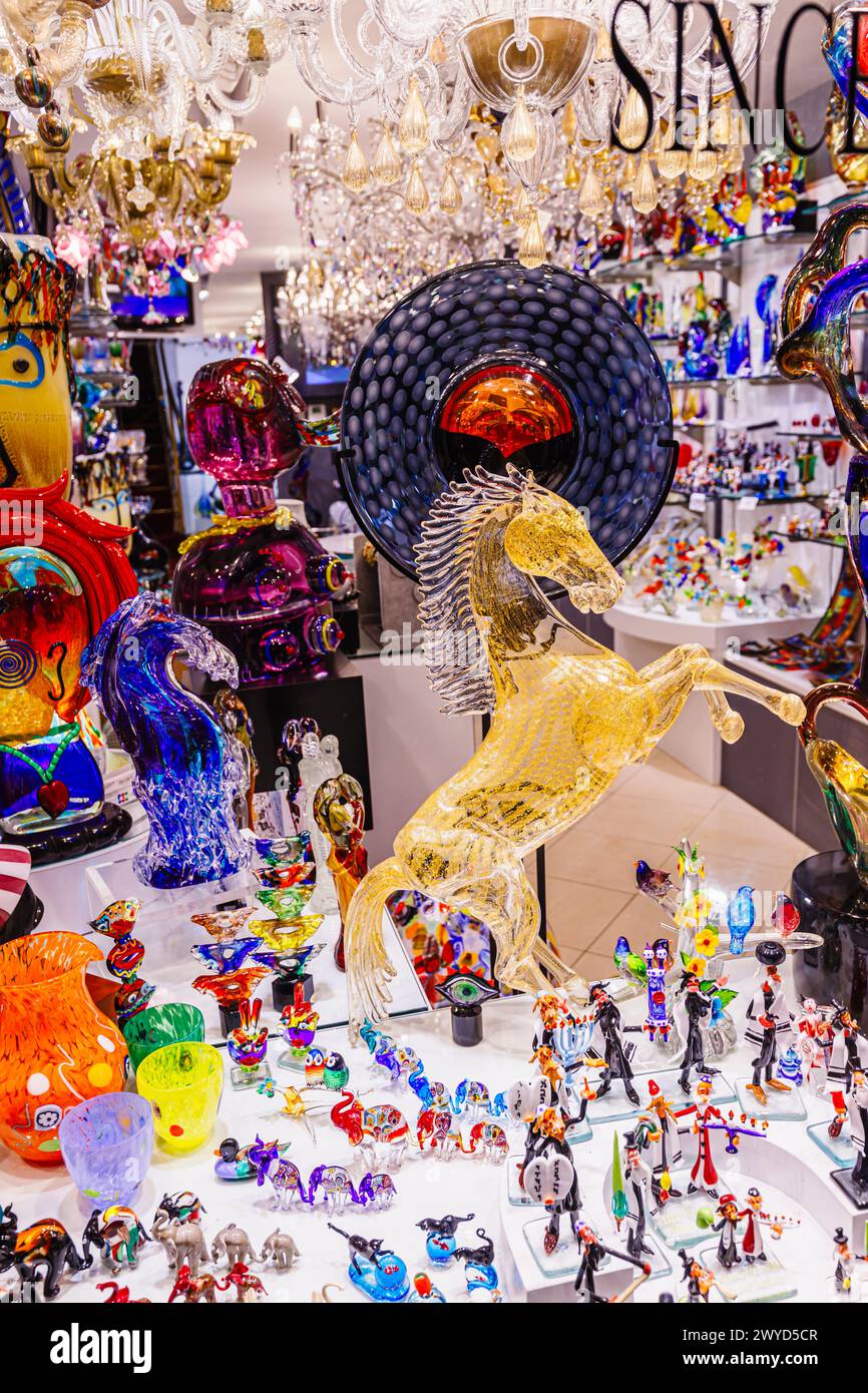 Display of colourful glasswork for tourist souvenirs in a shop window in Castello, Venice, Italy ...