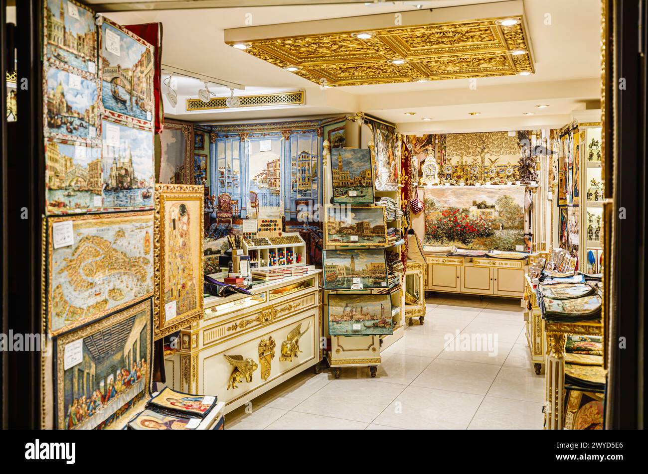Display of pictures and paintings for tourist souvenirs in an art shop window in San Marco ...