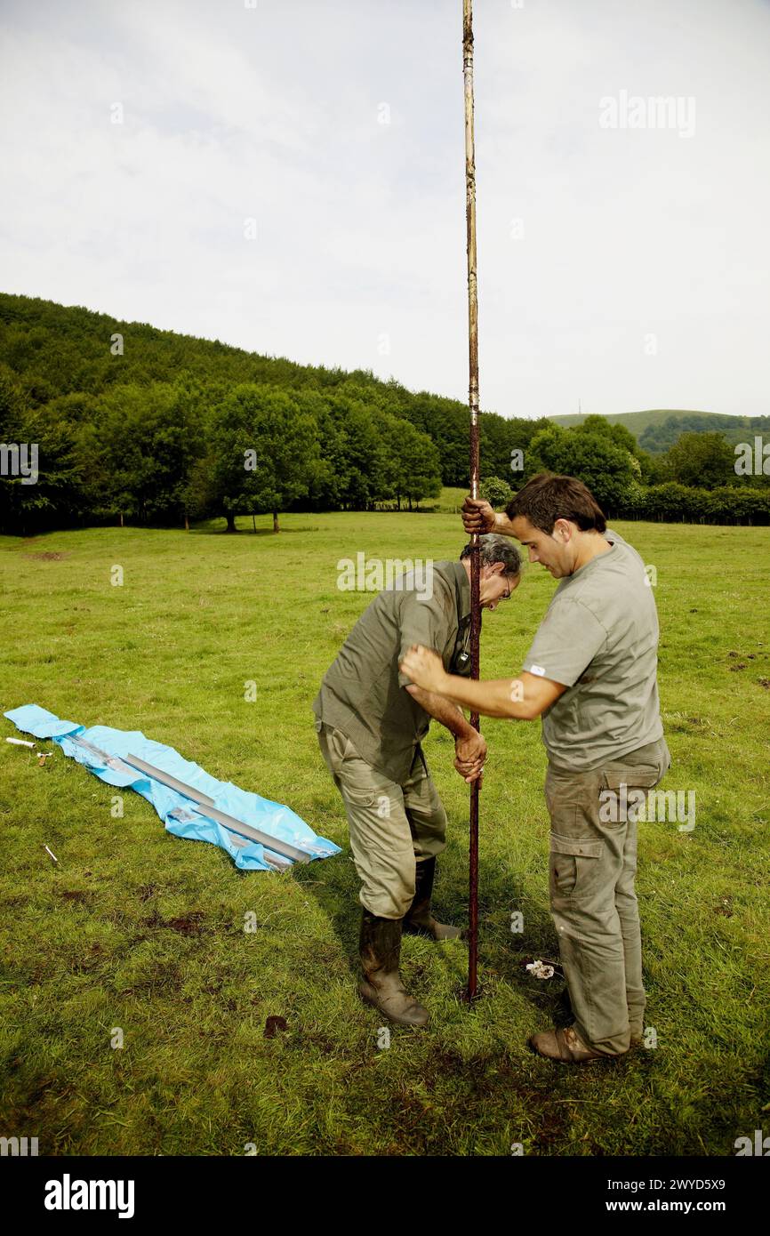 Men using Russian corer to sample peat, climate change research, Neiker ...