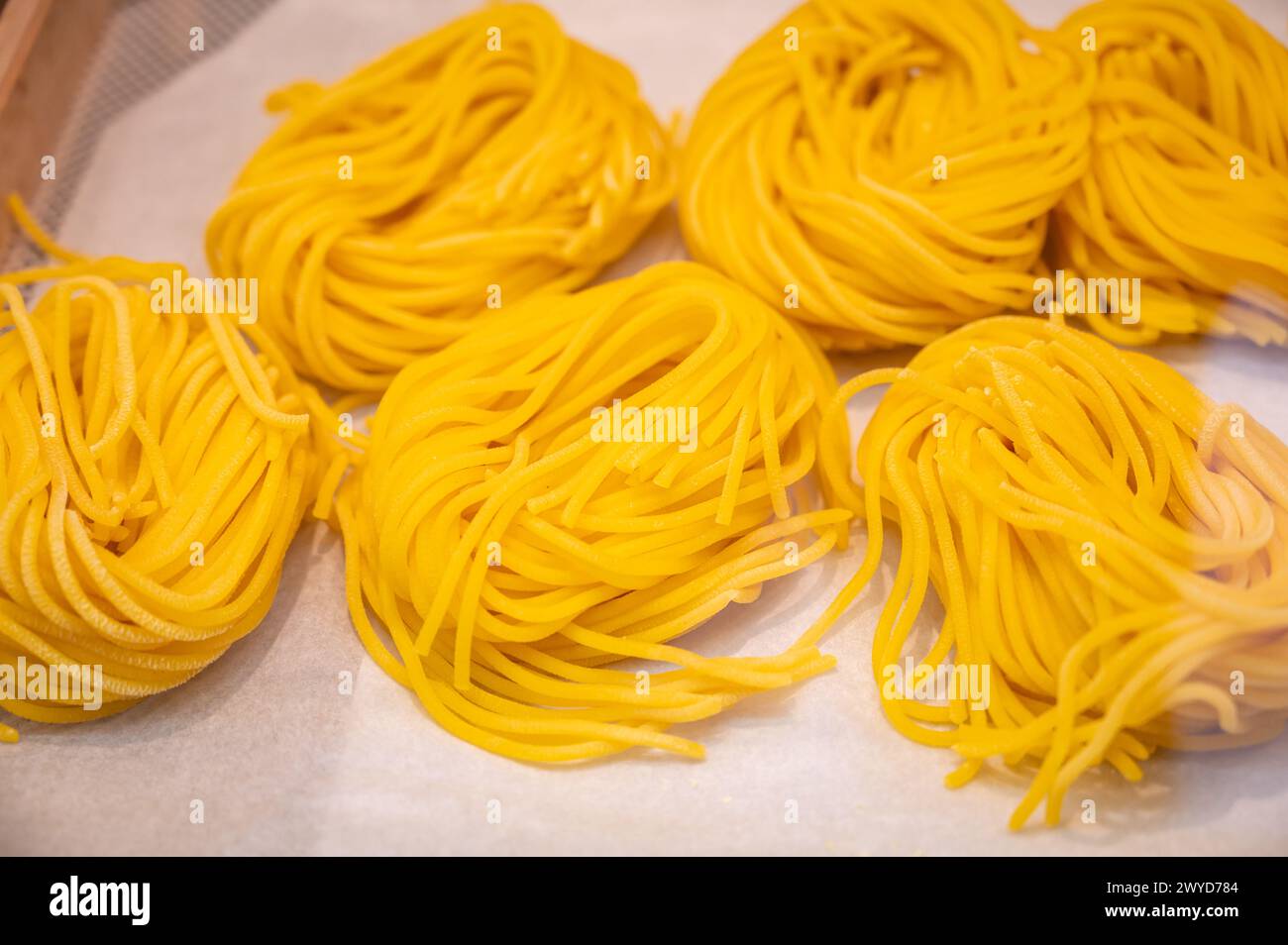 Italian food, fresh homemade yellow pasta with eggs ready to cook on ...