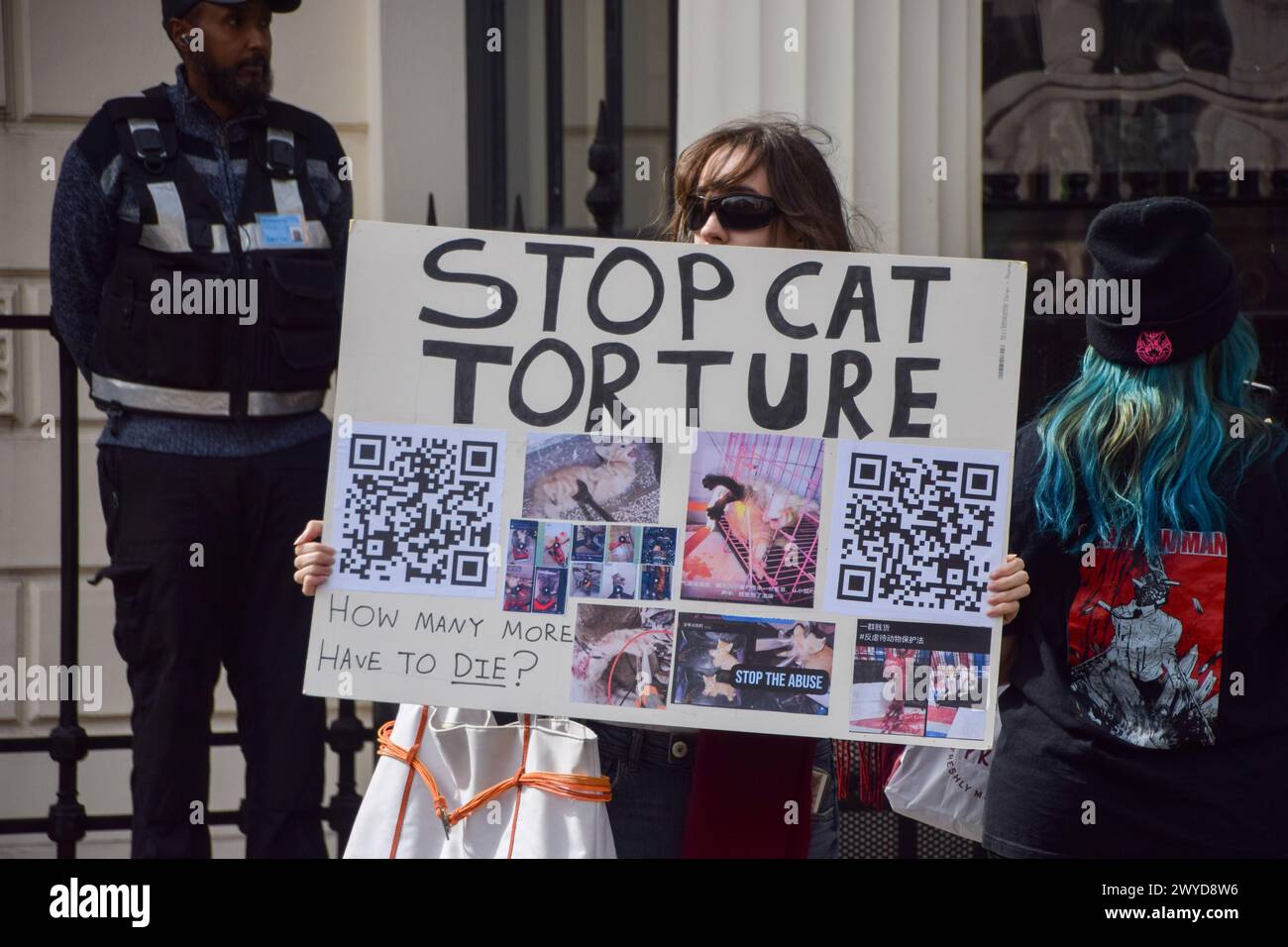 London, UK. 05th Apr, 2024. A protester holds a 'Stop cat torture ...