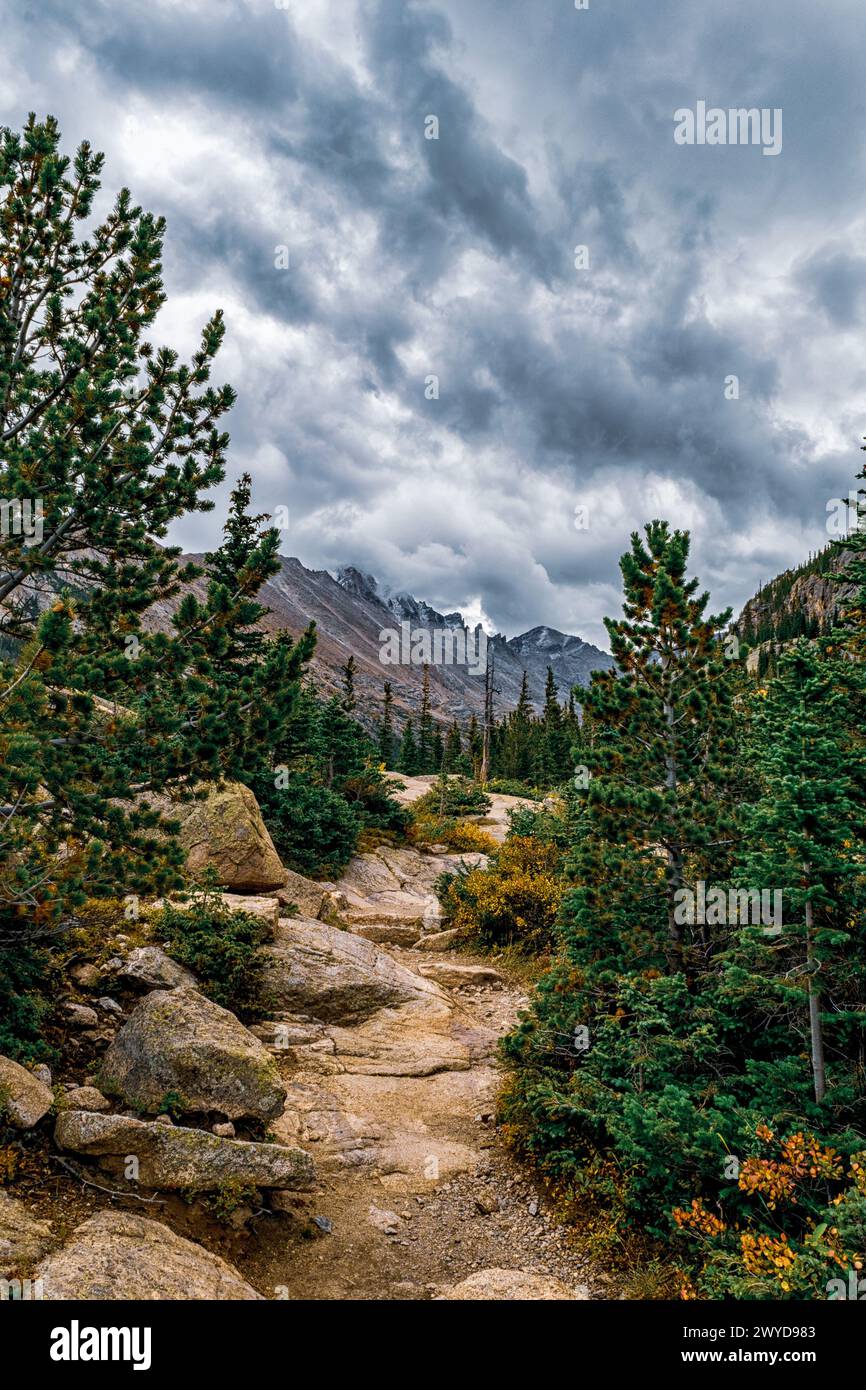 Storm clouds roll in along the path to Mills Lake at Rocky Mountain ...