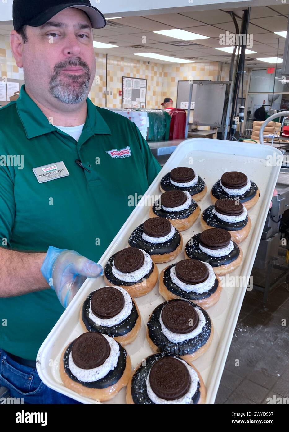 Special OREO donuts are displayed by an employee at a Krispy Kreme ...