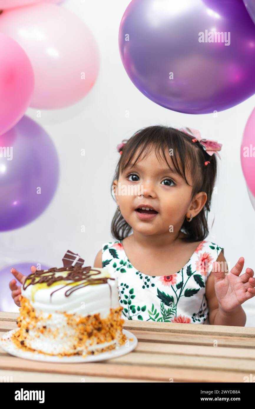 little latin brunette girl very happy smiling on her birthday in front ...