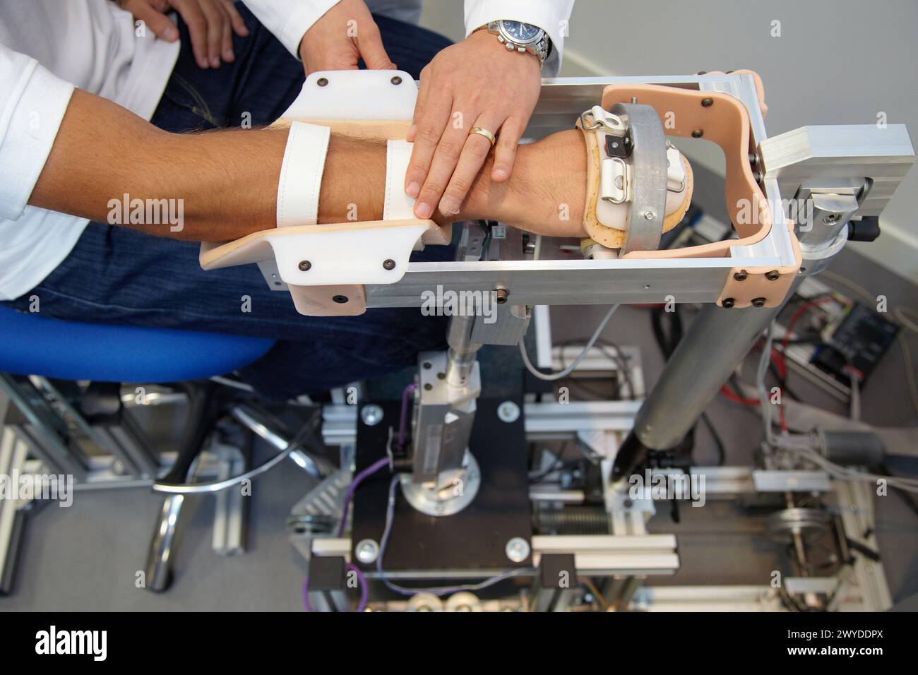 Researcher placing a patient clinical training device of the limb has ...