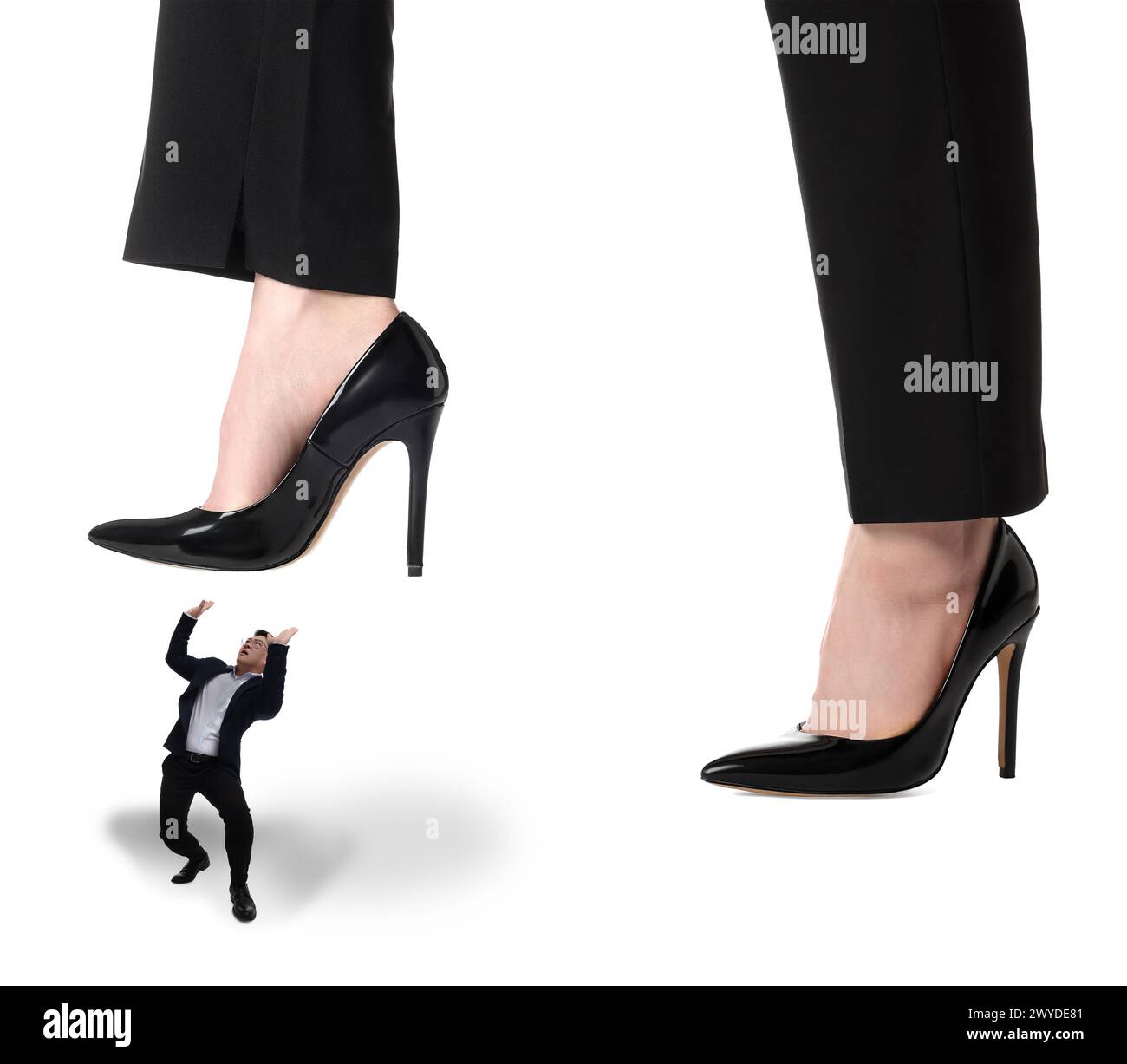 Big woman stepping onto small man on white background Stock Photo - Alamy