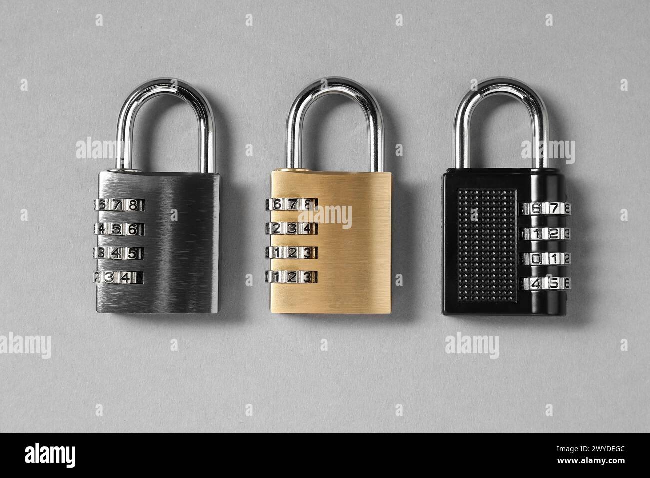 Steel combination padlocks on grey background, top view Stock Photo - Alamy