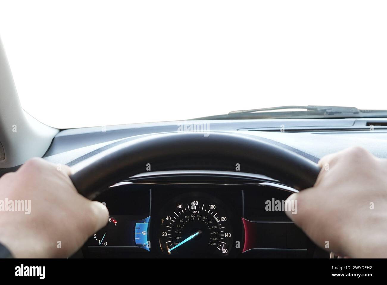 Man driving car with speedometer on dashboard, closeup Stock Photo - Alamy
