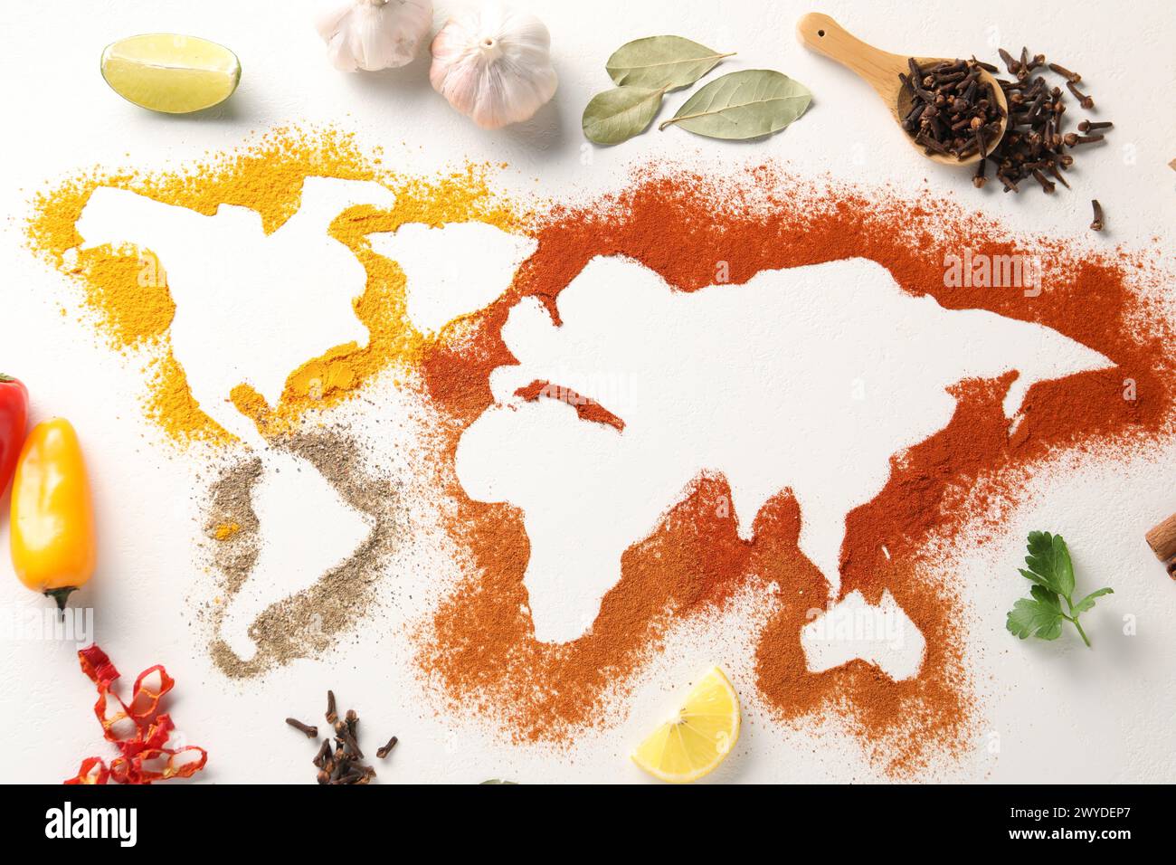 World map of different spices and products on white textured table ...