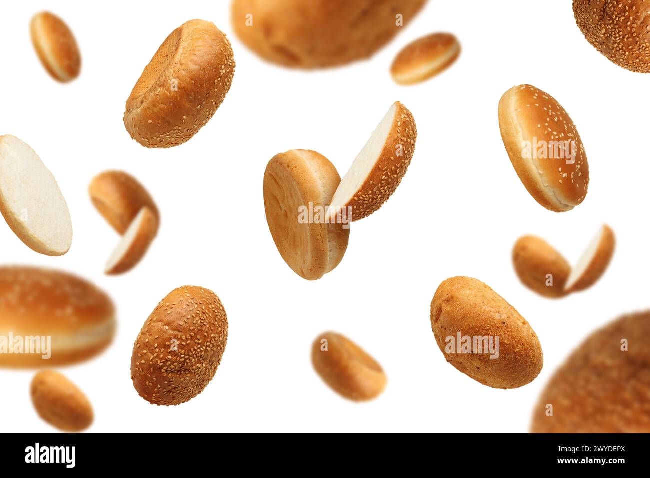 Fresh burger buns falling on white background Stock Photo - Alamy