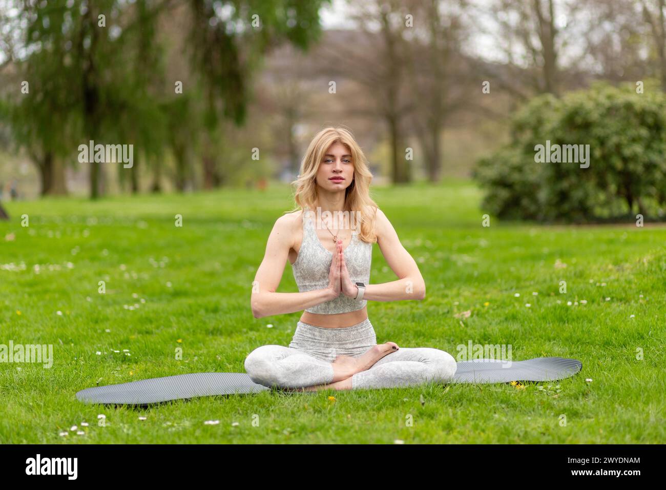 Woman in lotus pose hi-res stock photography and images - Alamy