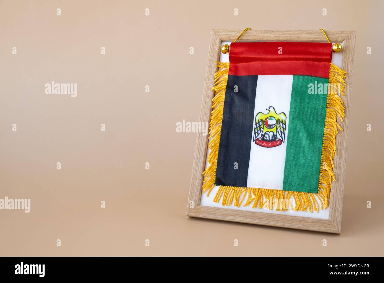 National symbol of UAE. United Arab Emirates small flag with Peregrine ...