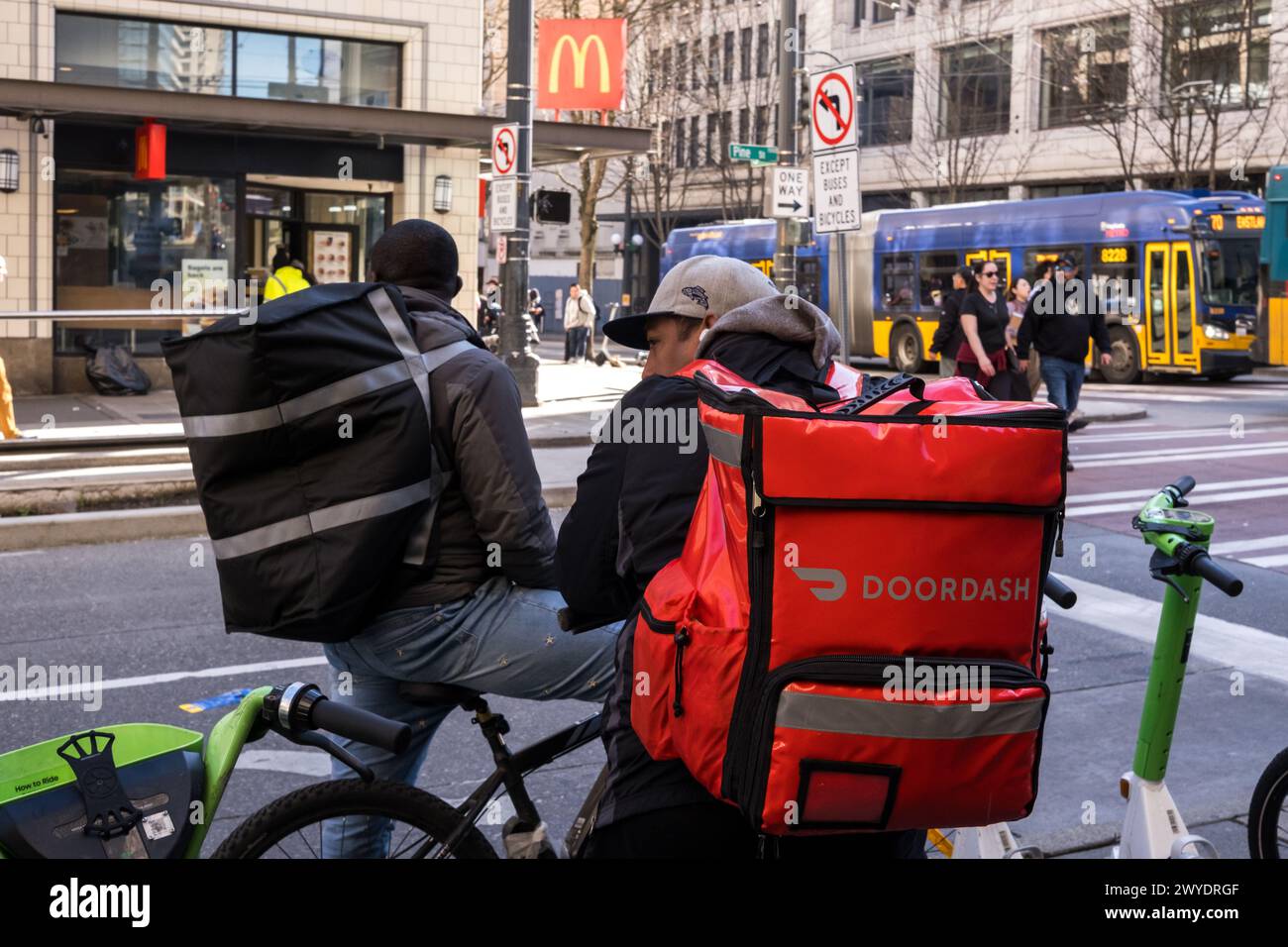 Seattle, USA. 17th Mar, 2024. Gig food delivery workers waiting in the ...