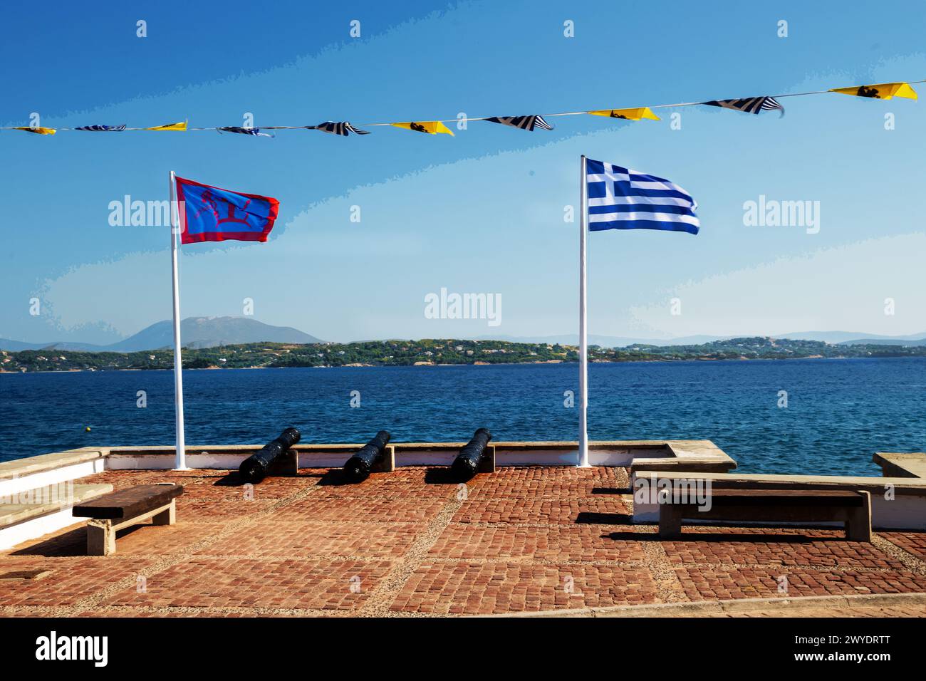 Flags of Greece amd maybe Spetses island . On other of canal - mainland ...
