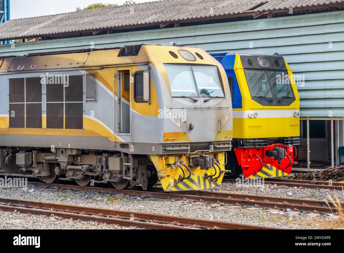 Head locomotive side view of the station platform and commuter train in ...
