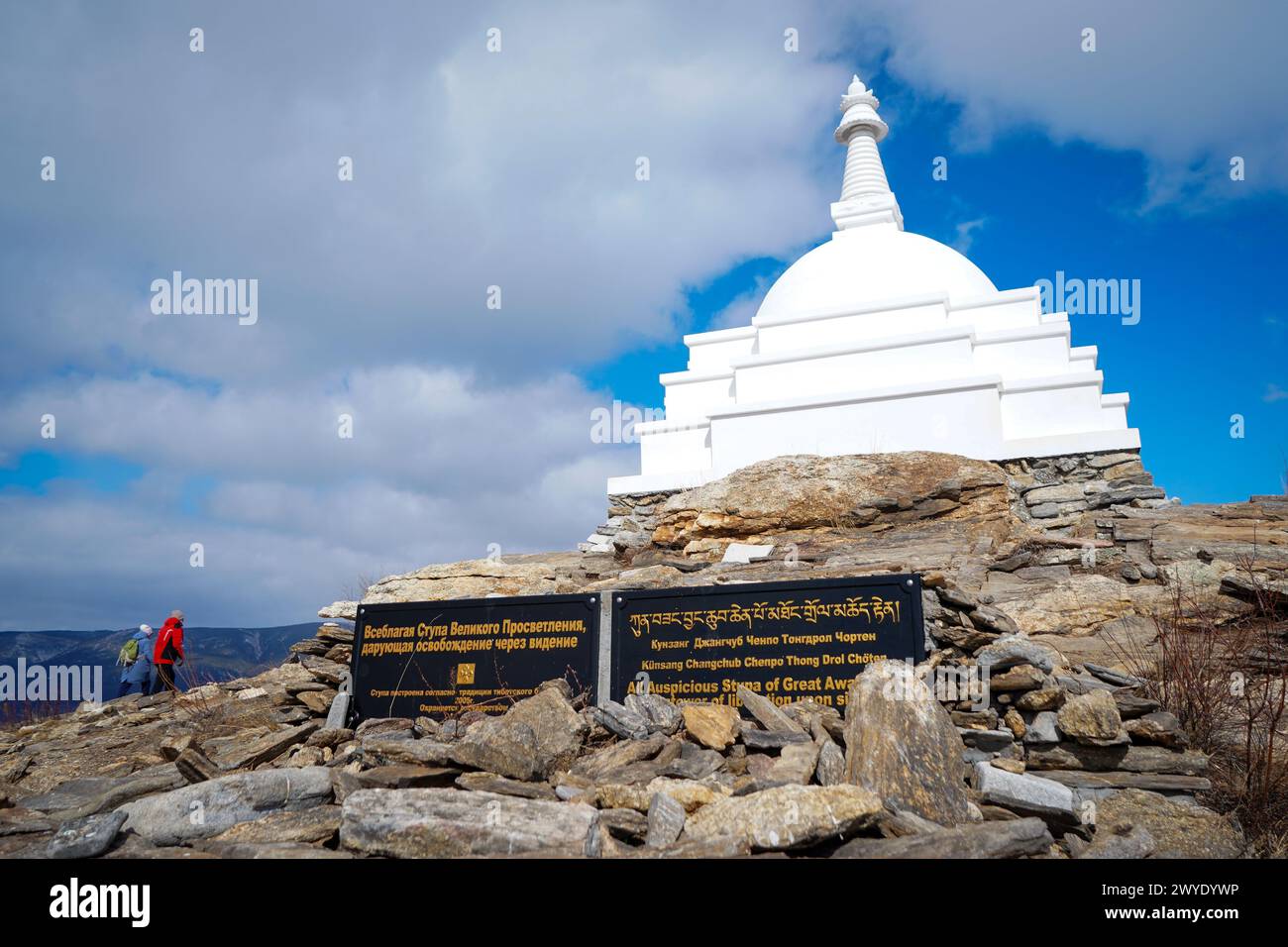 Two visitors circle around the Buddhist Stupa of Enlightenment on Ogoy ...