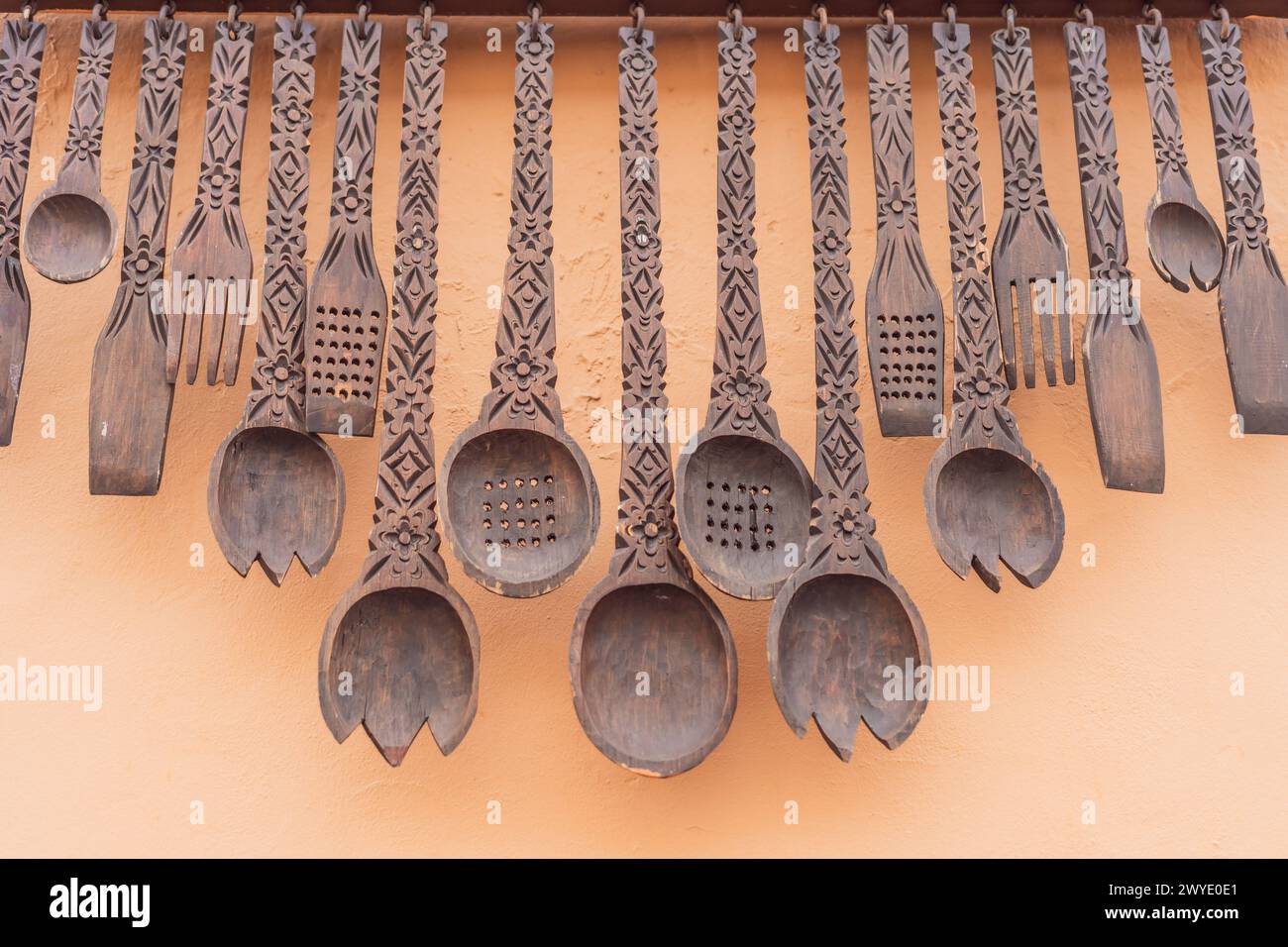 A collection of decorative large wooden spoons adds a touch of Mexican ...