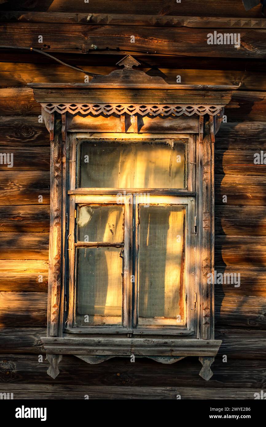 Window of an old wooden village house with platbands Stock Photo - Alamy