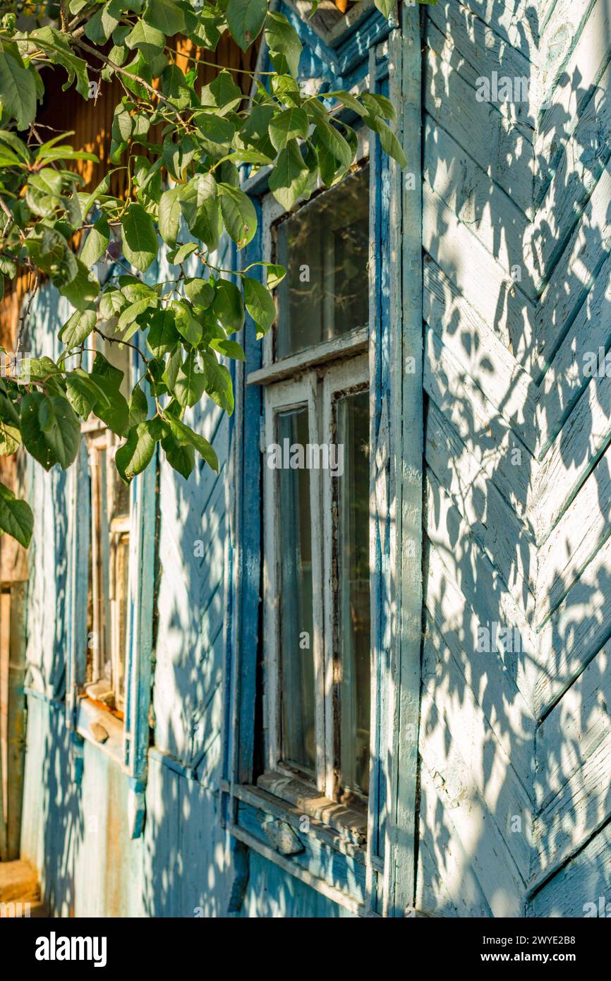 Window of an old wooden village house with platbands Stock Photo - Alamy