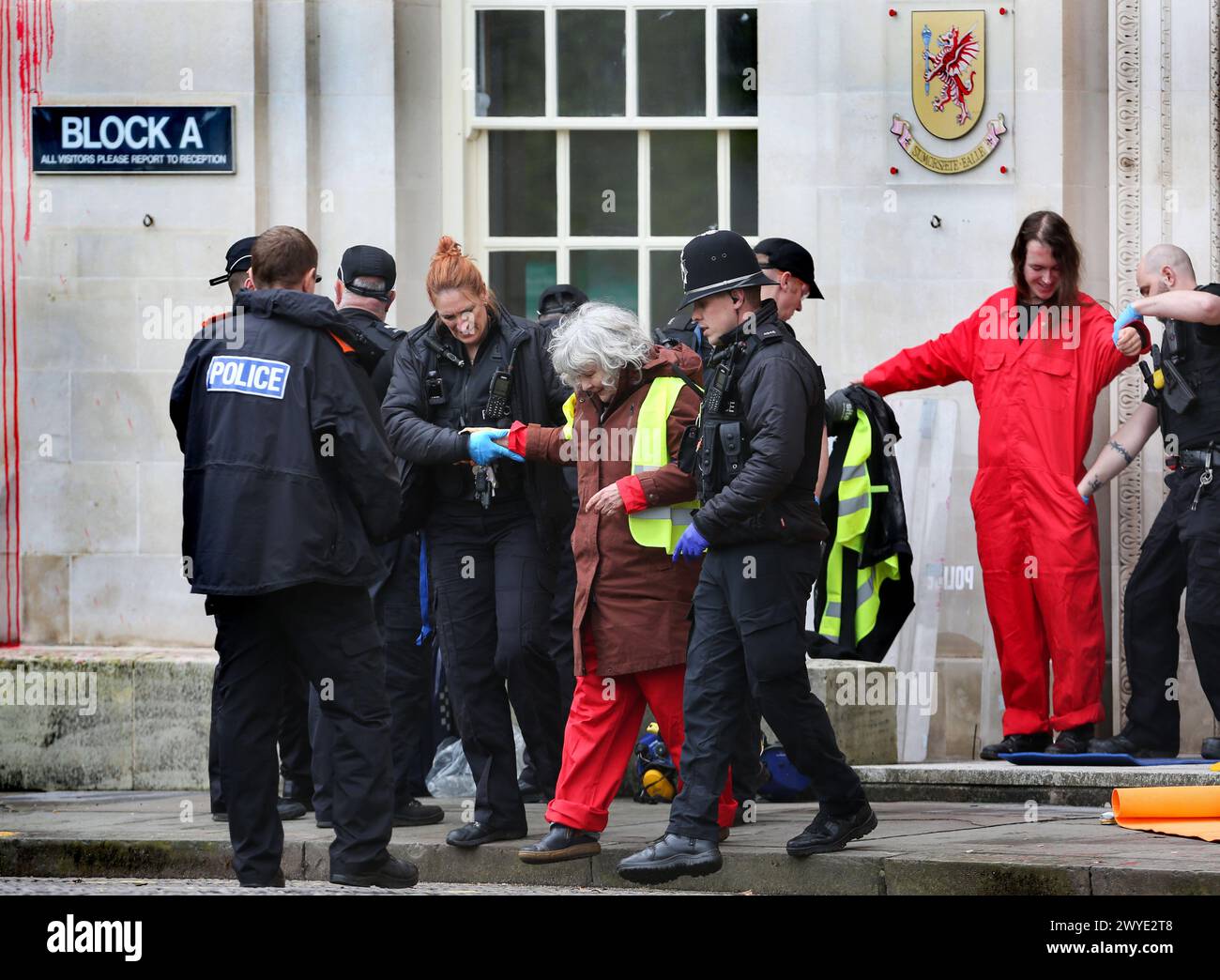 Protesters are led away after being arrested during a demonstration ...