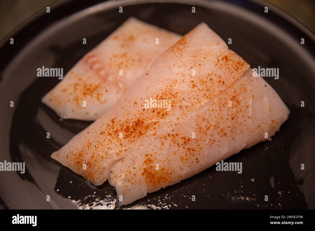 Portioned Red Snapper Filets with Cajun Seasoning Stock Photo - Alamy