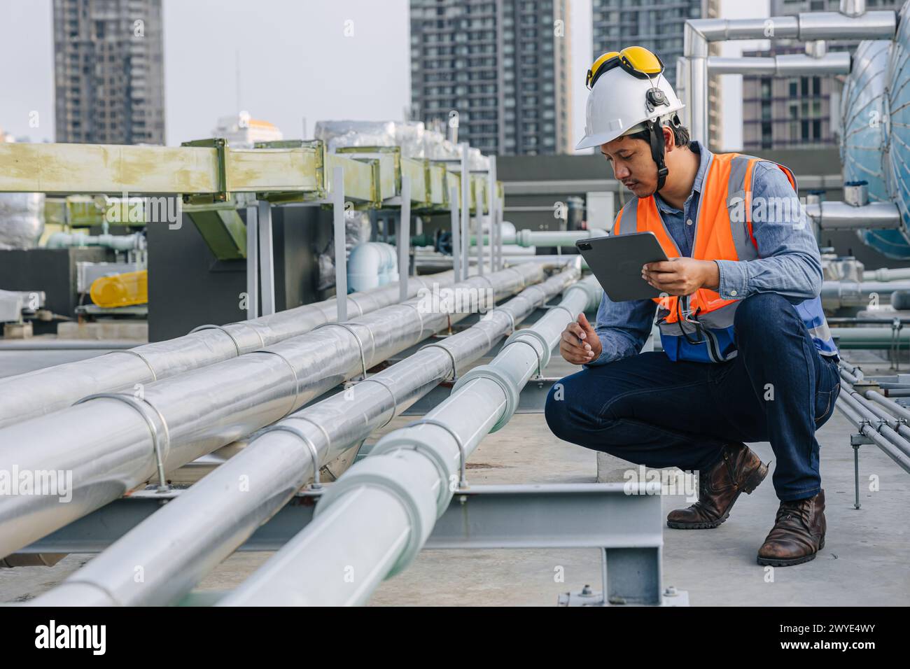 engineer male work checking water pipe inspecting valve testing water ...