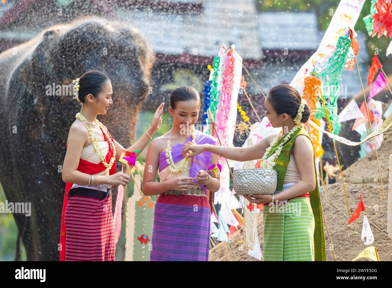 Songkran festival. Northern Thai people in Traditional clothes dressing ...