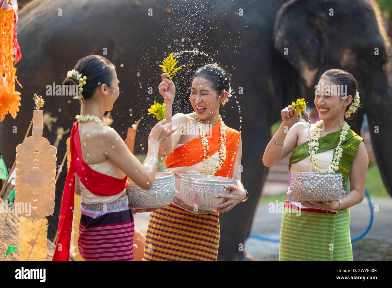 Songkran festival. Northern Thai people in Traditional clothes dressing ...