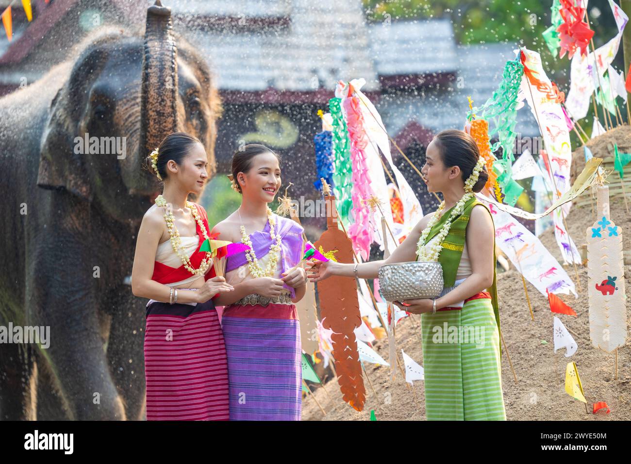 Songkran festival. Northern Thai people in Traditional clothes dressing ...