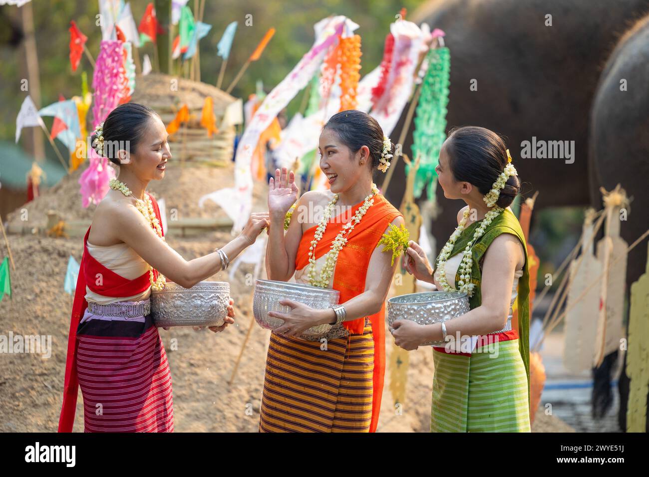 Songkran festival. Northern Thai people in Traditional clothes dressing ...