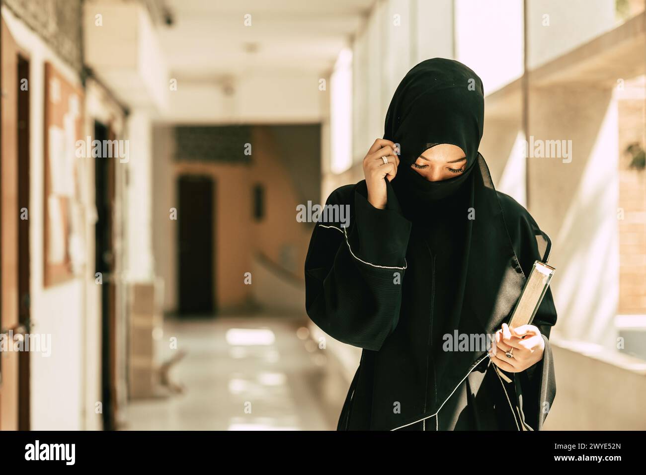 Muslim niqab woman read and learning the Quran and faith The Holy Al ...