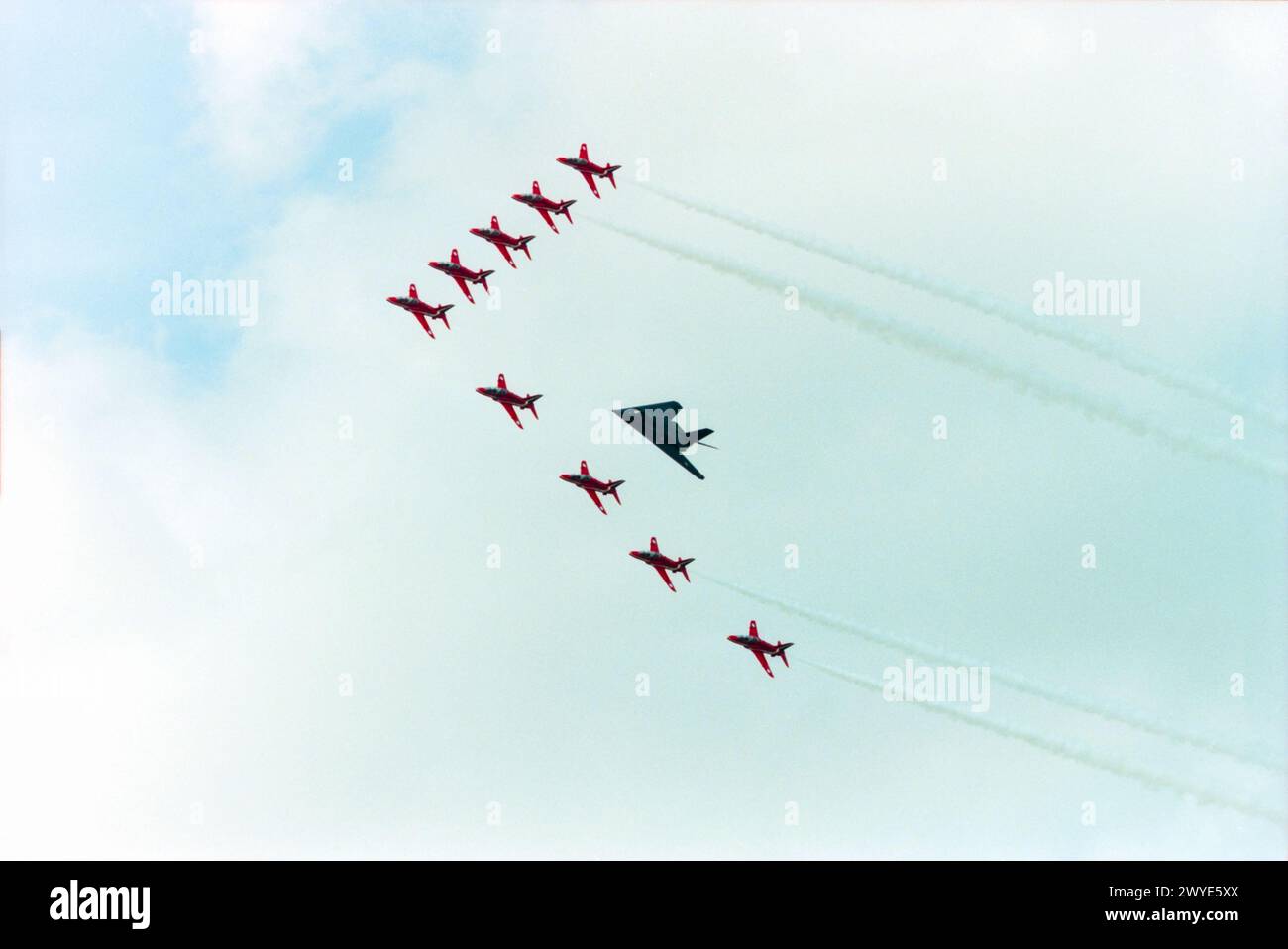 Royal Air Force Red Arrows display team in formation with a USAF ...