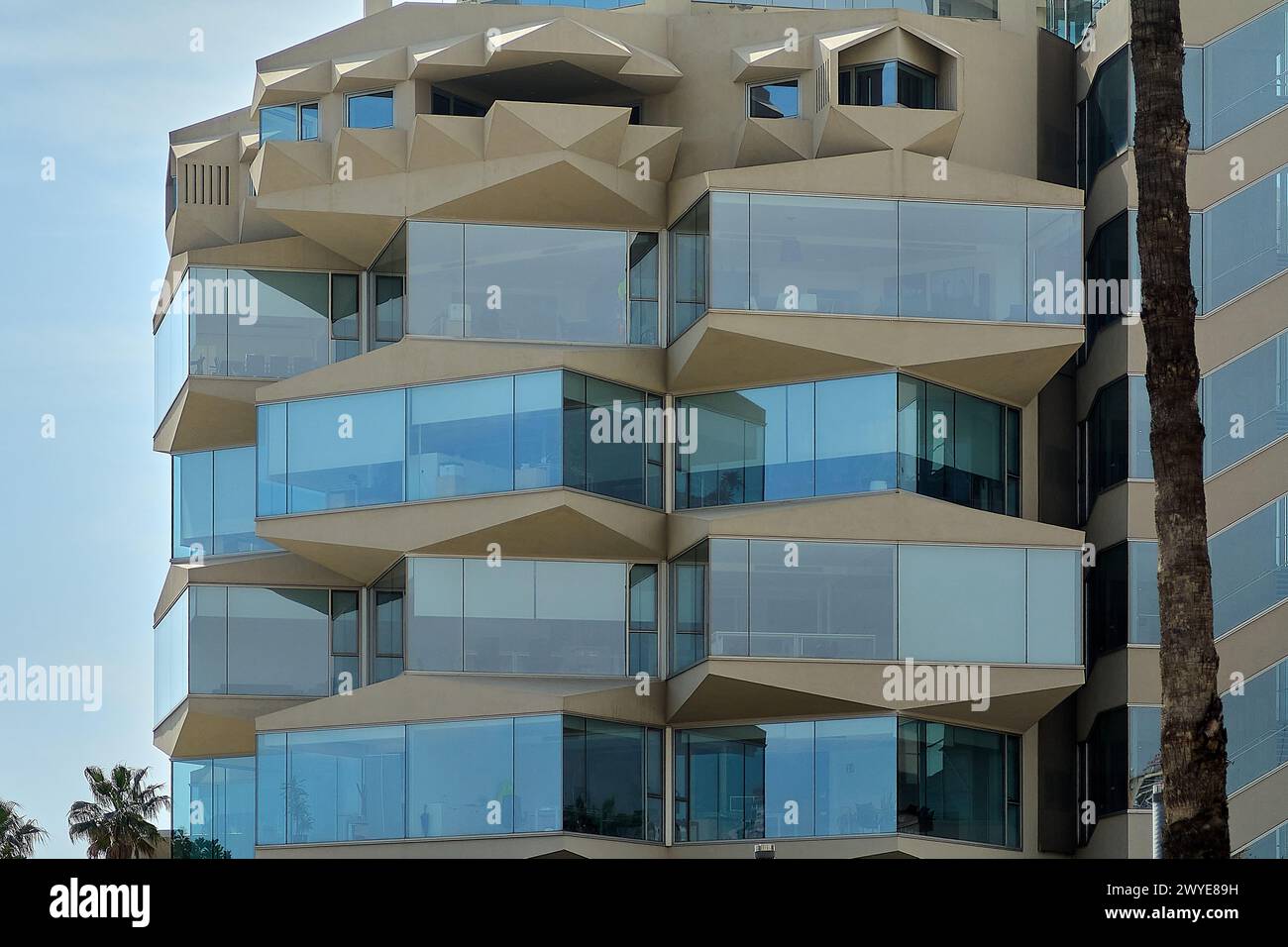 Facade of a building in Catalonia with an angular design, where glass ...