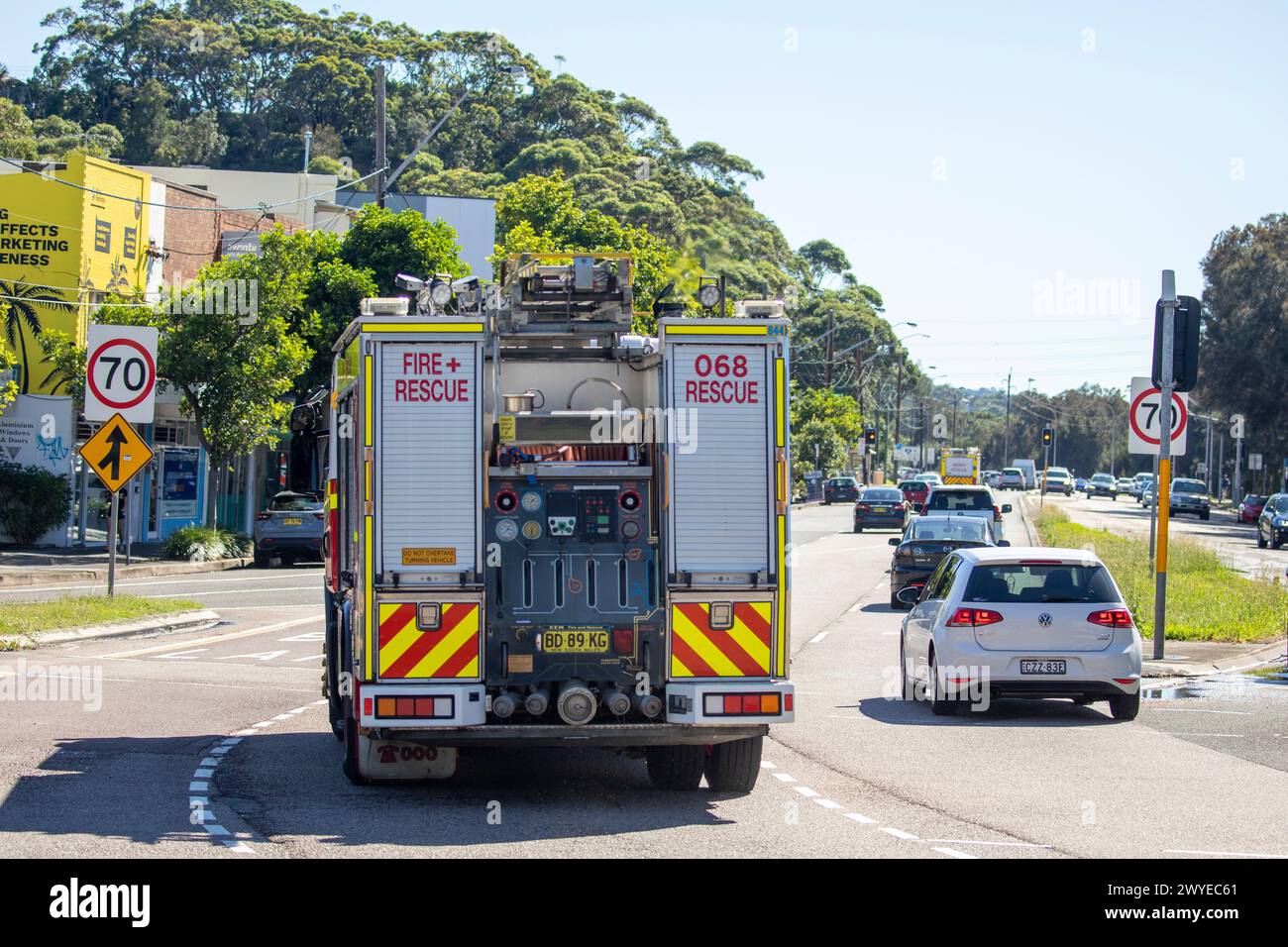 Australia, Fire and Rescue fire engine driving along Pittwater Road in ...